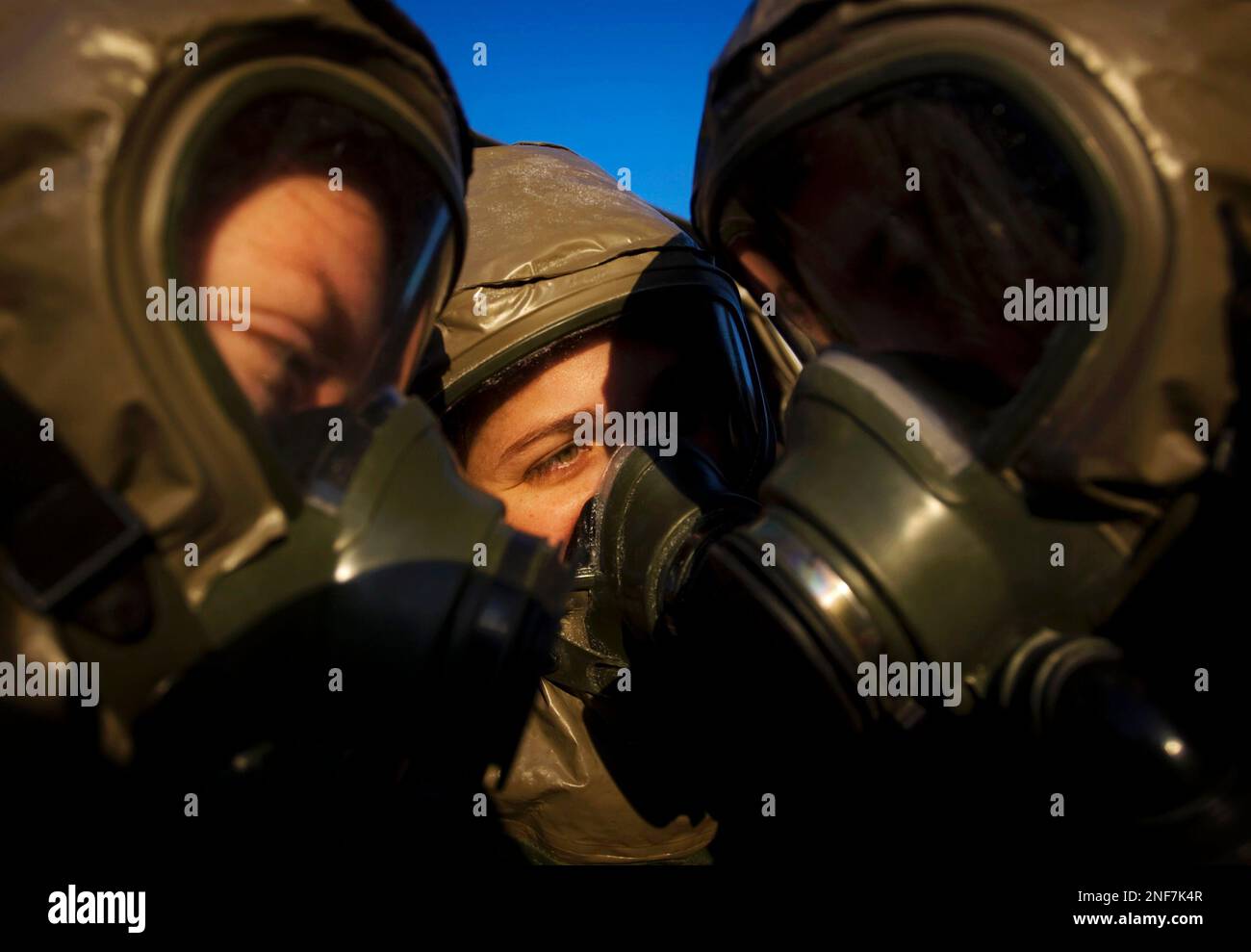 Israeli soldiers wear gas masks as they take part in a home front ...