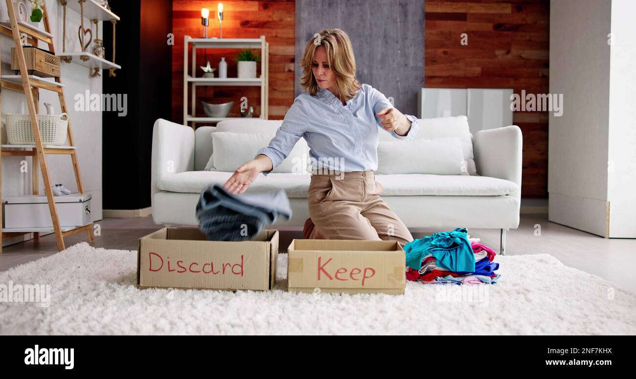 Closet Declutter And Cleaning. Organized Woman Discarding Clothes Stock ...