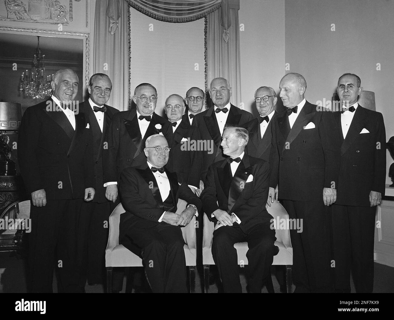 President Harry Truman, center, attends the Motion Picture Association Theater in Washington on ...
