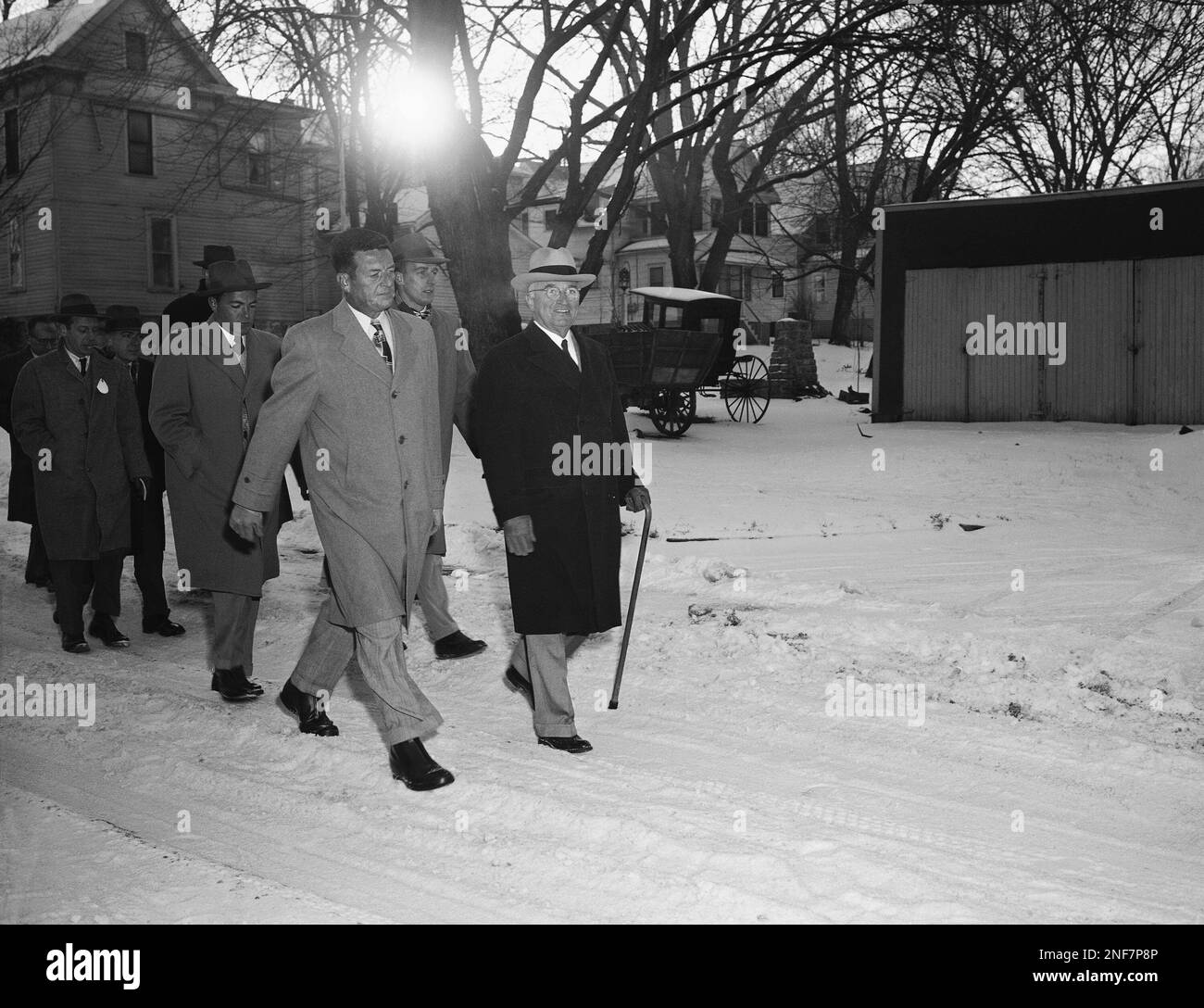 President Harry S. Truman, flanked by a member of his Secret Service ...