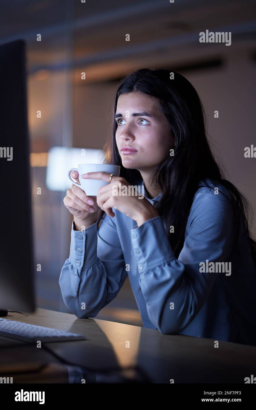 Coffee, thinking and woman working overtime in newspaper office ...
