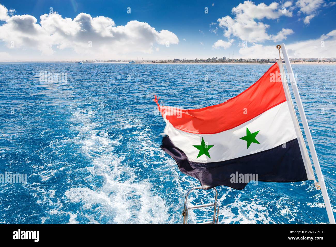 The Syrian flag is flying at the stern of a pleasure boat. View from ...