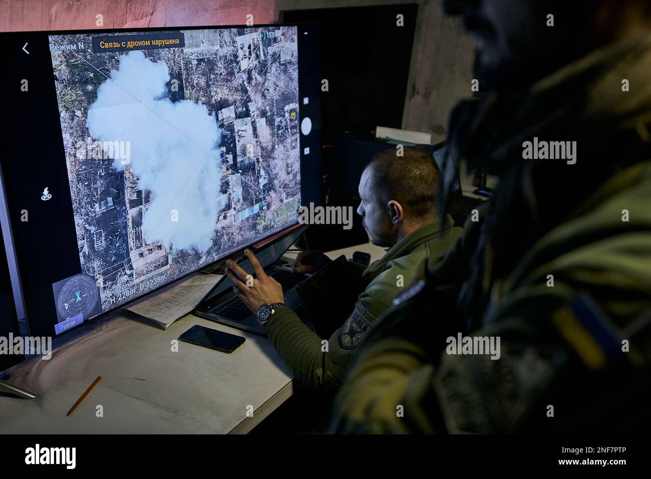 FILE - Ukrainian soldiers watch a drone feed from an underground ...
