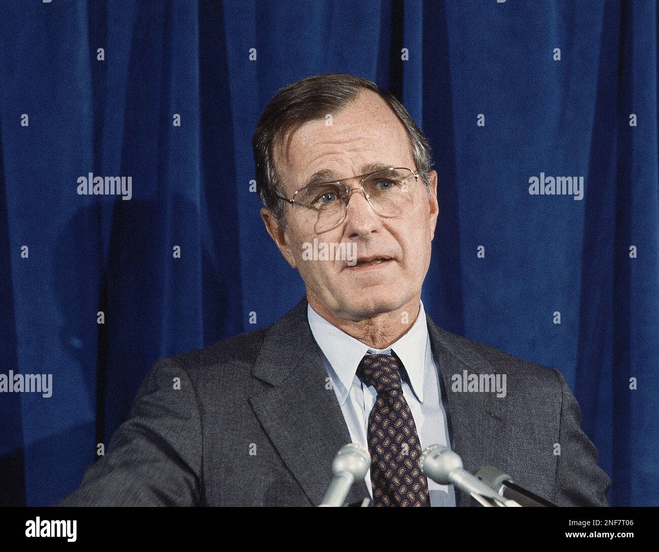 U.S. President George H. Bush, shown talking at the Washington Press ...