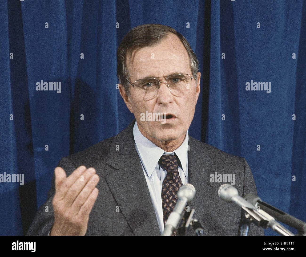 U.S. President George H. Bush, shown talking at the Washington Press ...