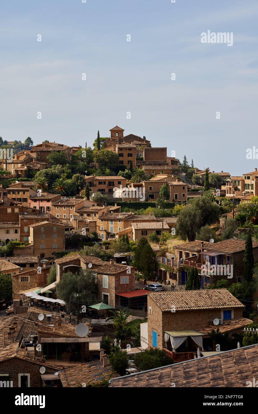 An aerial view of cityscape Deia surrounded by buildings Stock Photo ...