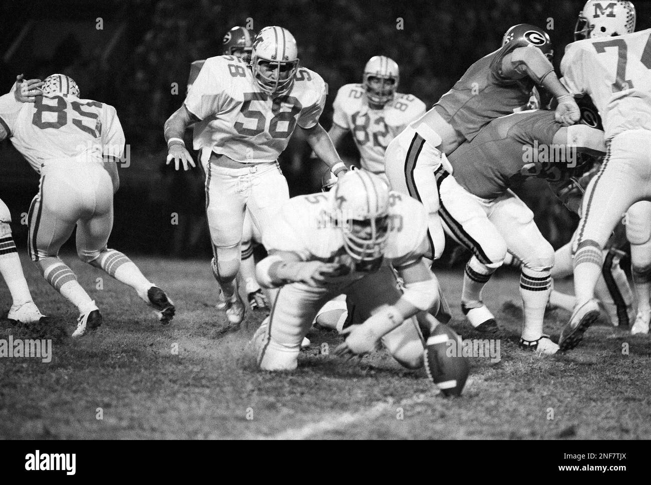 Miami of Ohio linebacker John Roudabush, center, goes after a ...