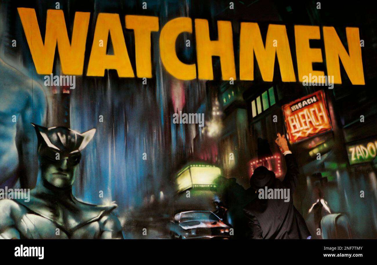 A graffiti artist finishes the last details of a poster of the film ...