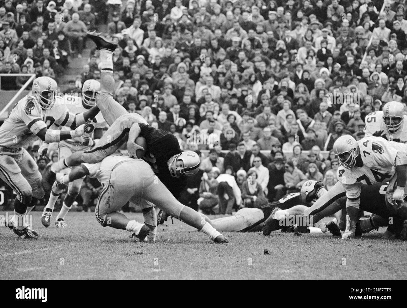 Charlie Jarvis, Army's hard charging fullback, gets flipped over the ...