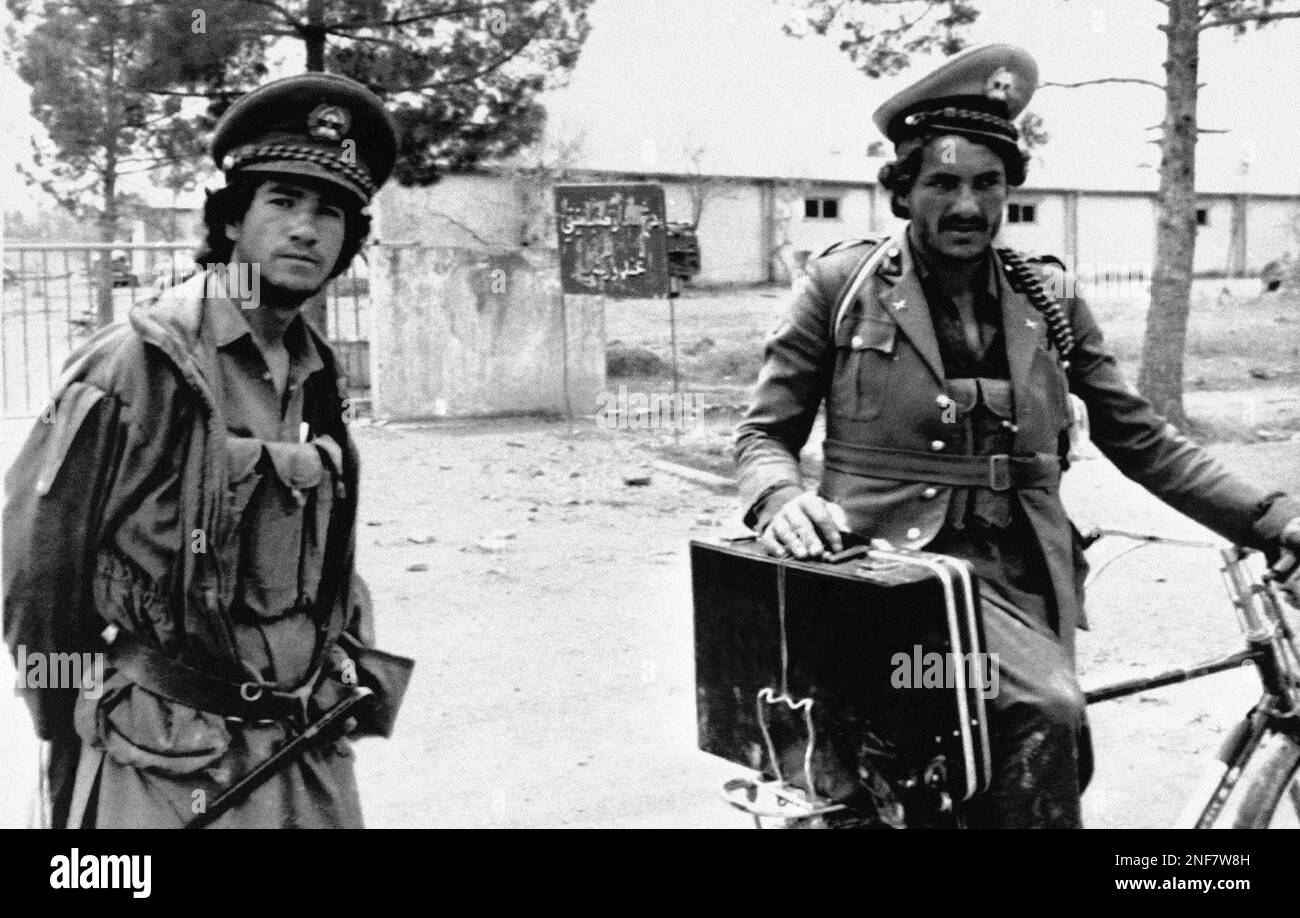 Afghan guerrillas wear uniforms of Afghan military officers in front of ...