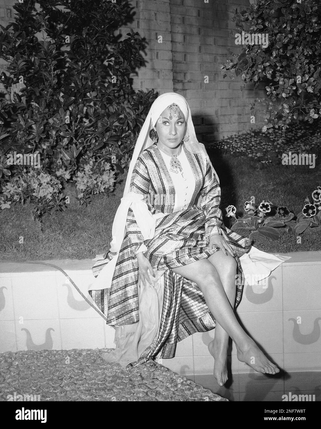 Yma Sumac poses by a pond on set of "The Loves of Omar Khayyam," the ...