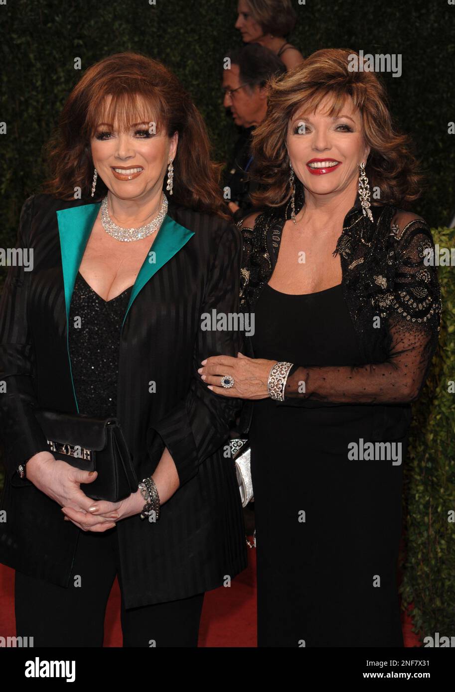 Joan Collins, right, and Jackie Collins arrive at the Vanity Fair Oscar ...