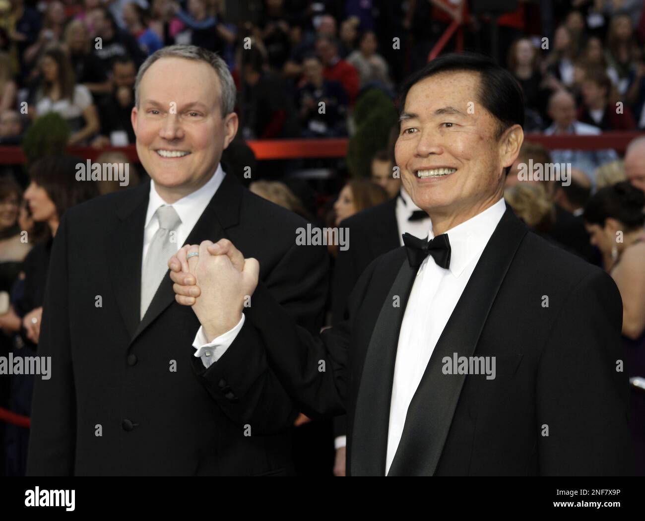 Actor George Takei, right, and his partner Brad Altman arrive for the ...