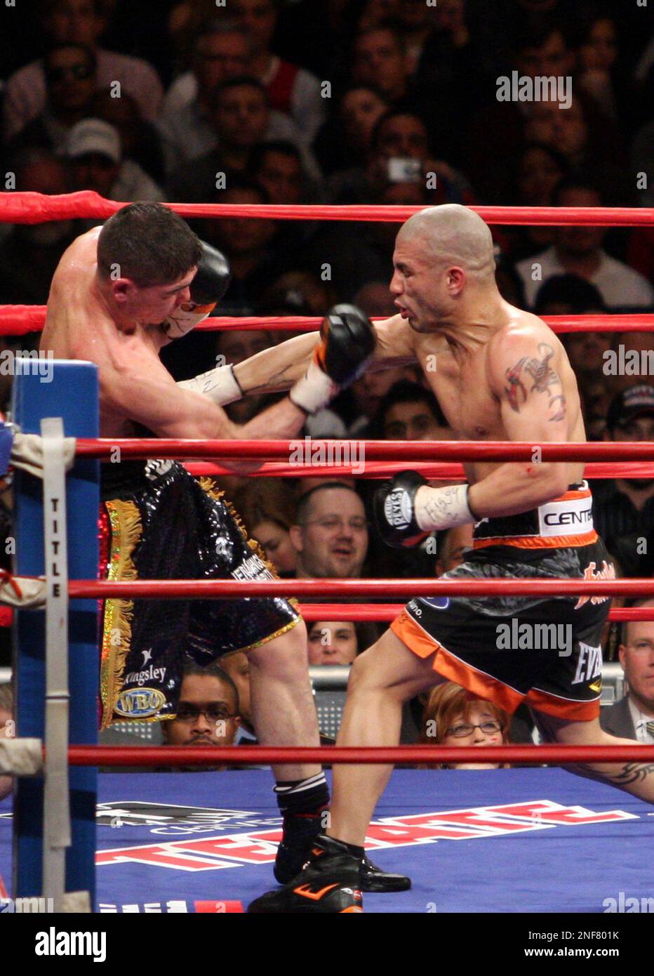 Miguel Cotto, right, of Puerto Rico, in action against Michael Jennings ...