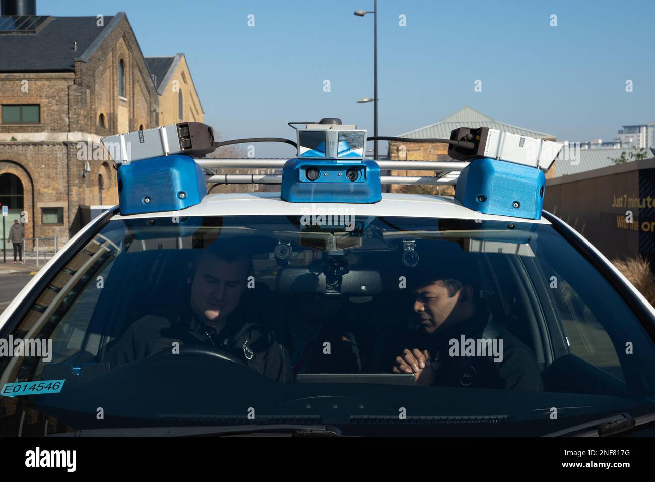 Cameras on top a self-driving Nissan Leaf car as it is driven on public ...