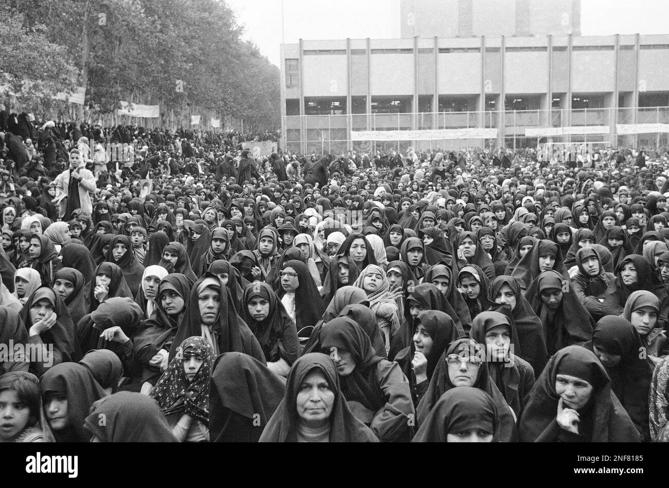 A crowd of Iranian women wearing the traditional chador, join an anti-U ...