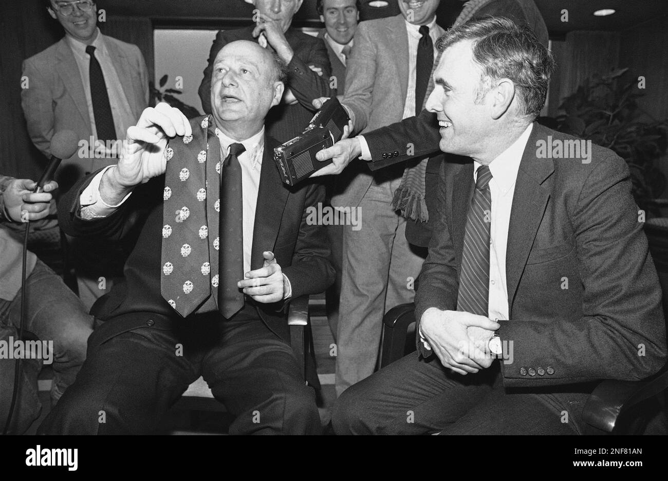 New York Ed Koch, left, holds up the New York City tie prior to ...