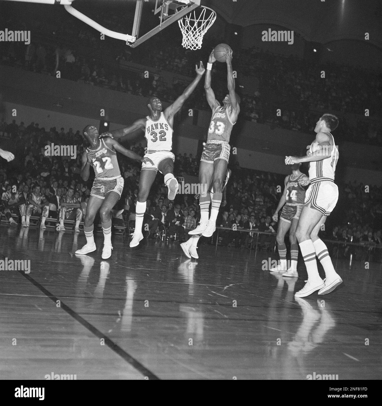 Tom Hawkins of the Los Angeles Lakers hauls in a rebound in first ...