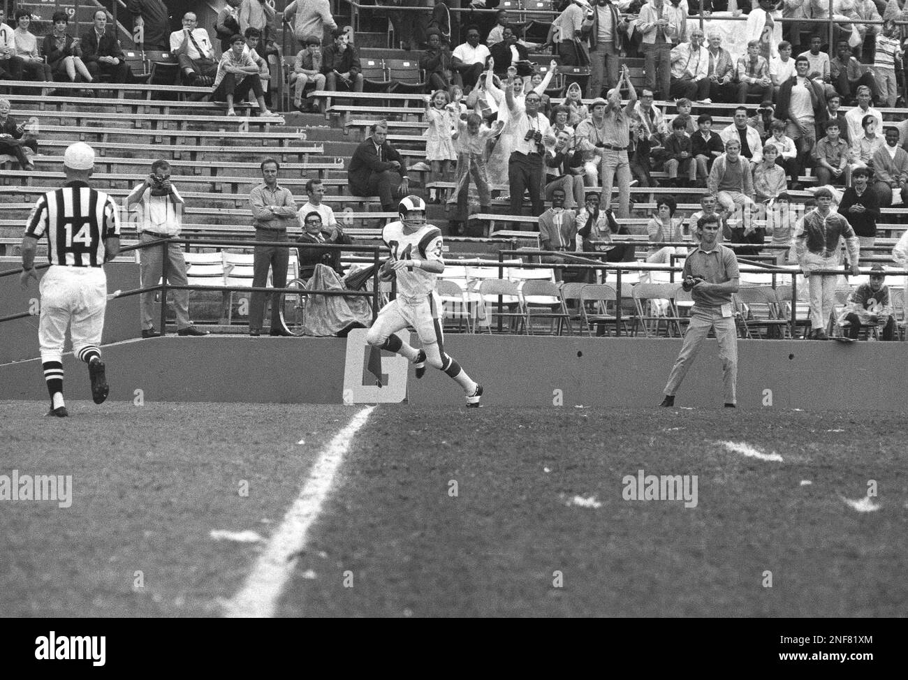 After catching a pass from quarterback Roman Gabriel, Les Josephson (34 ...