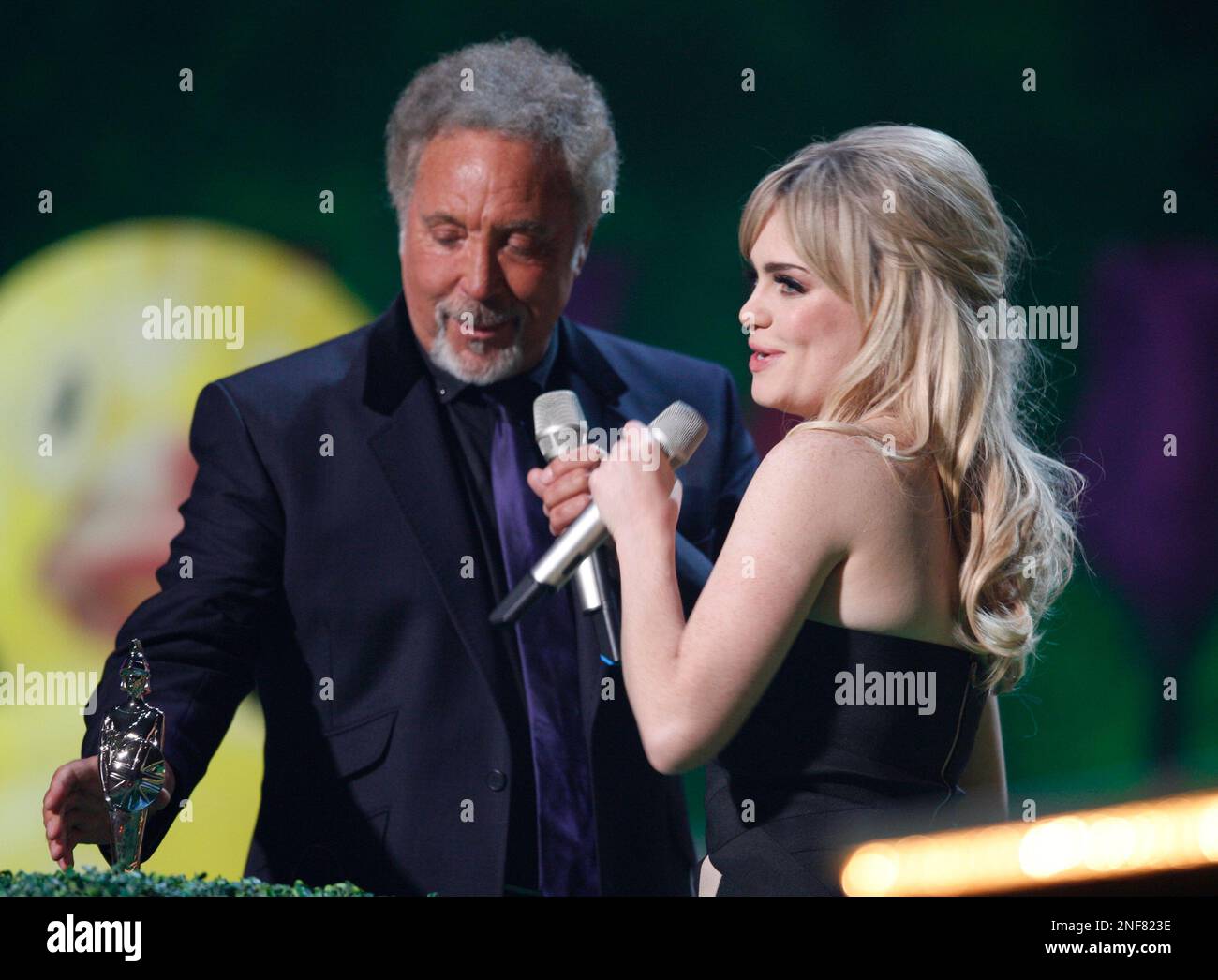 British singer Duffy, right, receives an award from Tom Jones at the ...