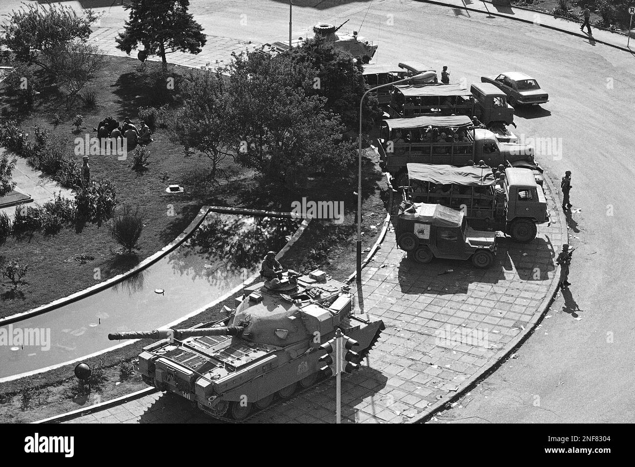 A tank and soldiers in military vehicle at Ferdowsi square near the ...