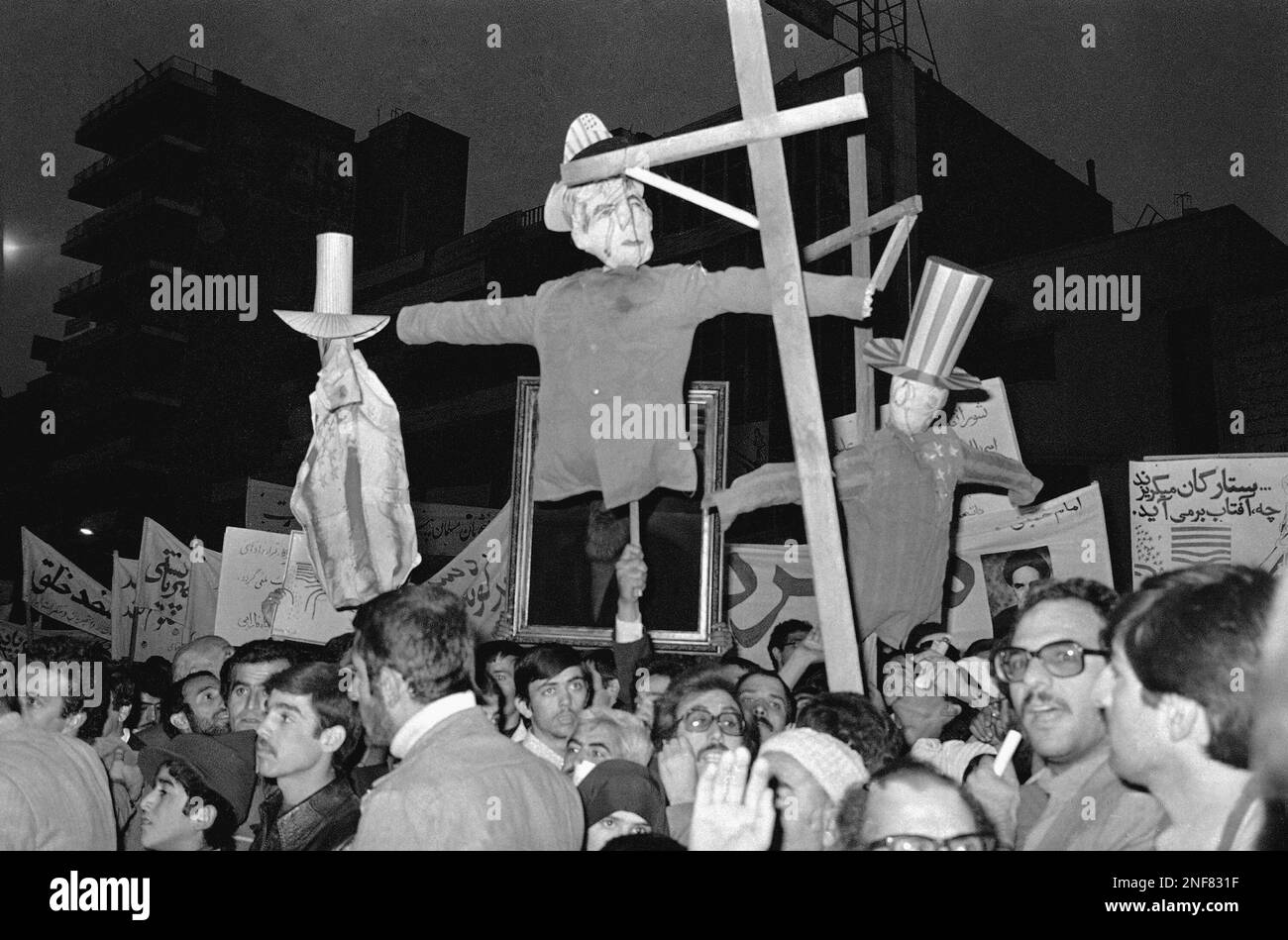 Demonstrators outside the U.S. Embassy in Tehran Nov.19, 1979 carry ...