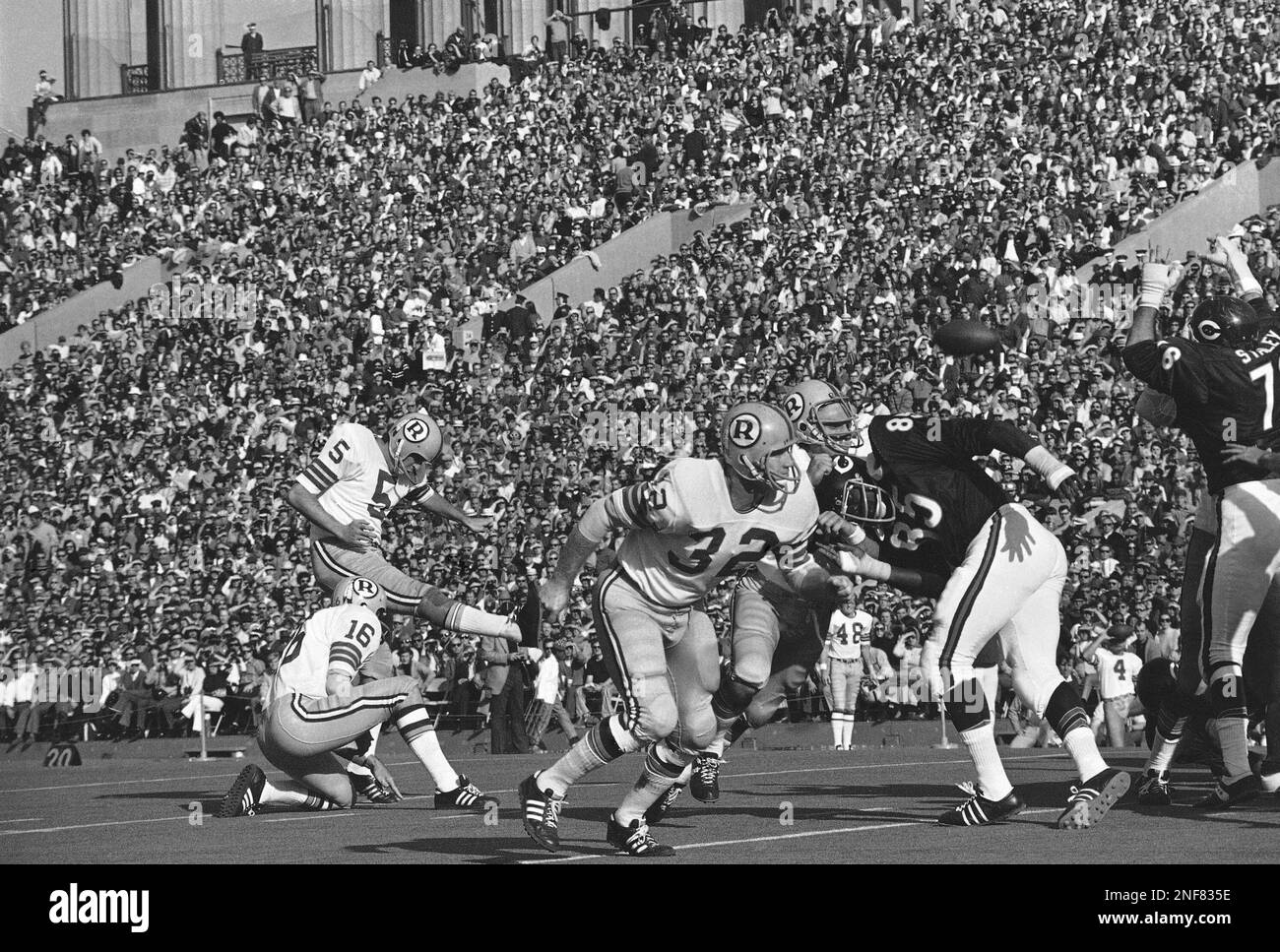 As Richie Petitbon (16) holds, Washington Redskins kicking specialist ...
