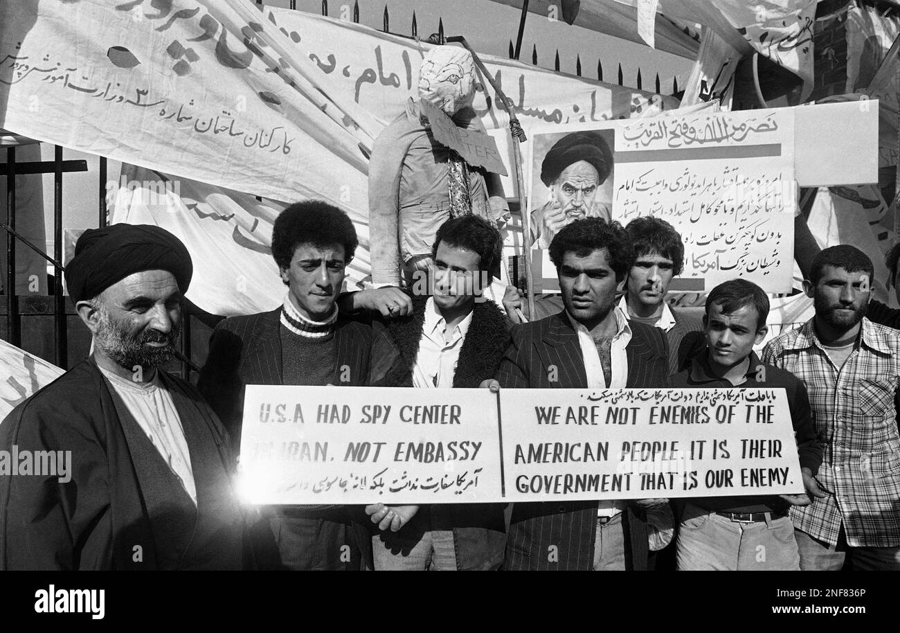 Demonstrators show the placards they are carrying during their march ...