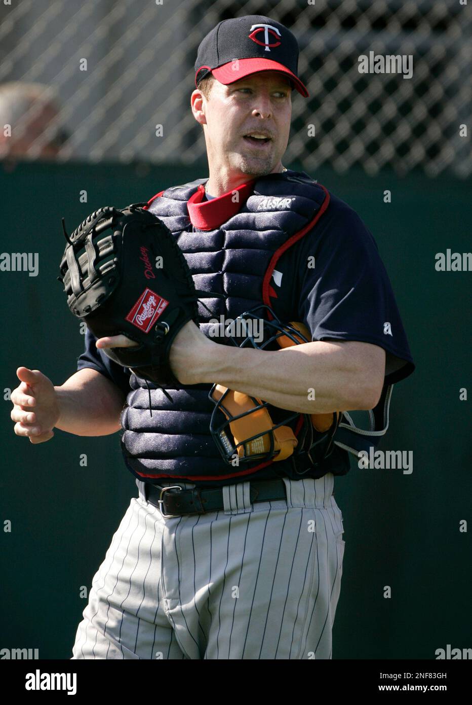 Minnesota Twins catcher Mike Redmond steps onto the field during a ...