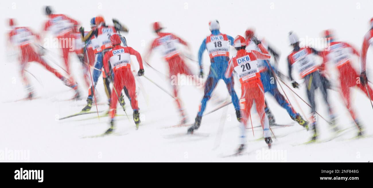 Athlete take a curve during the men's 10 km mass start race at the ...