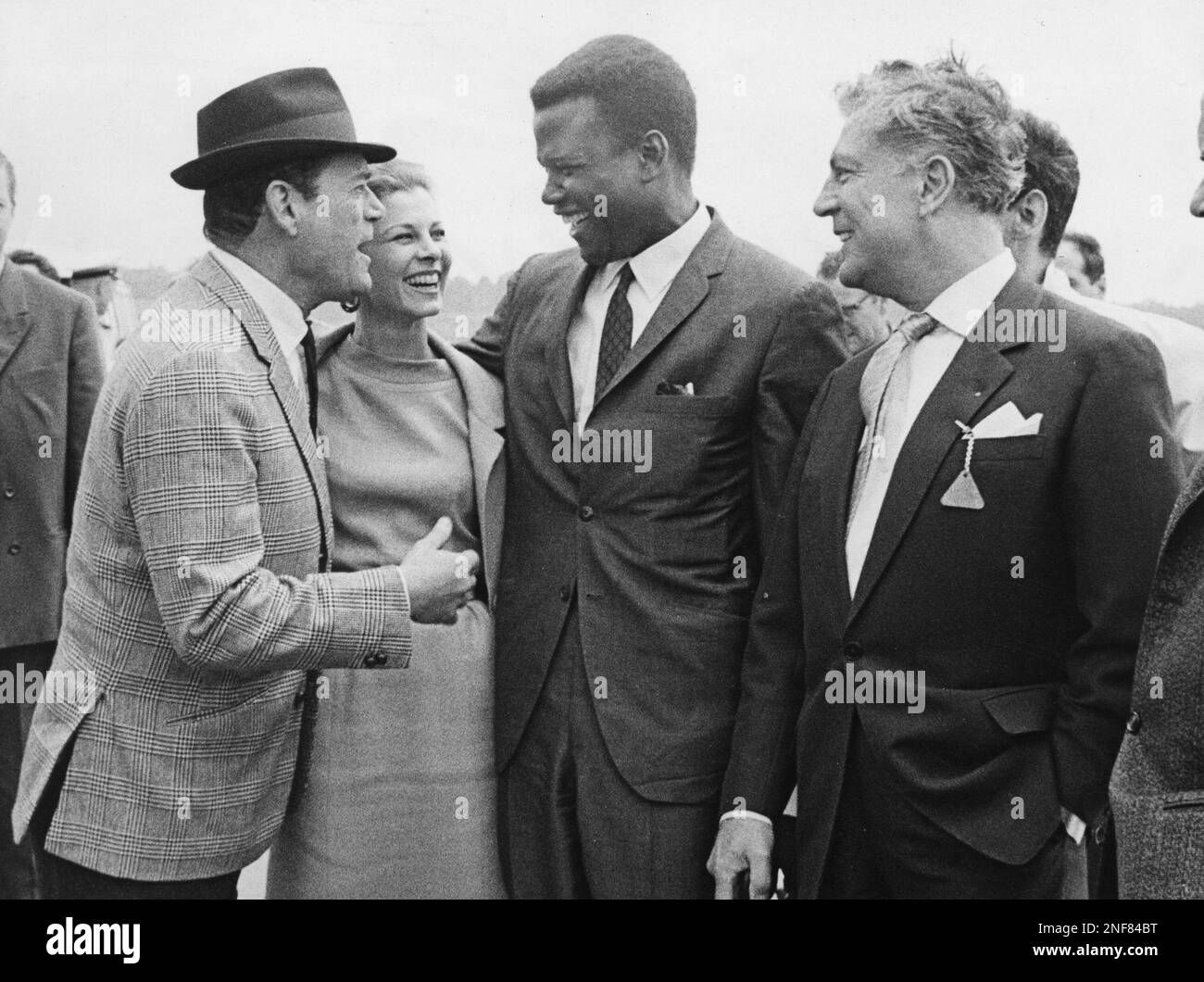 U.S. American actor and singer Eddie Constantine, left, embraces his ...
