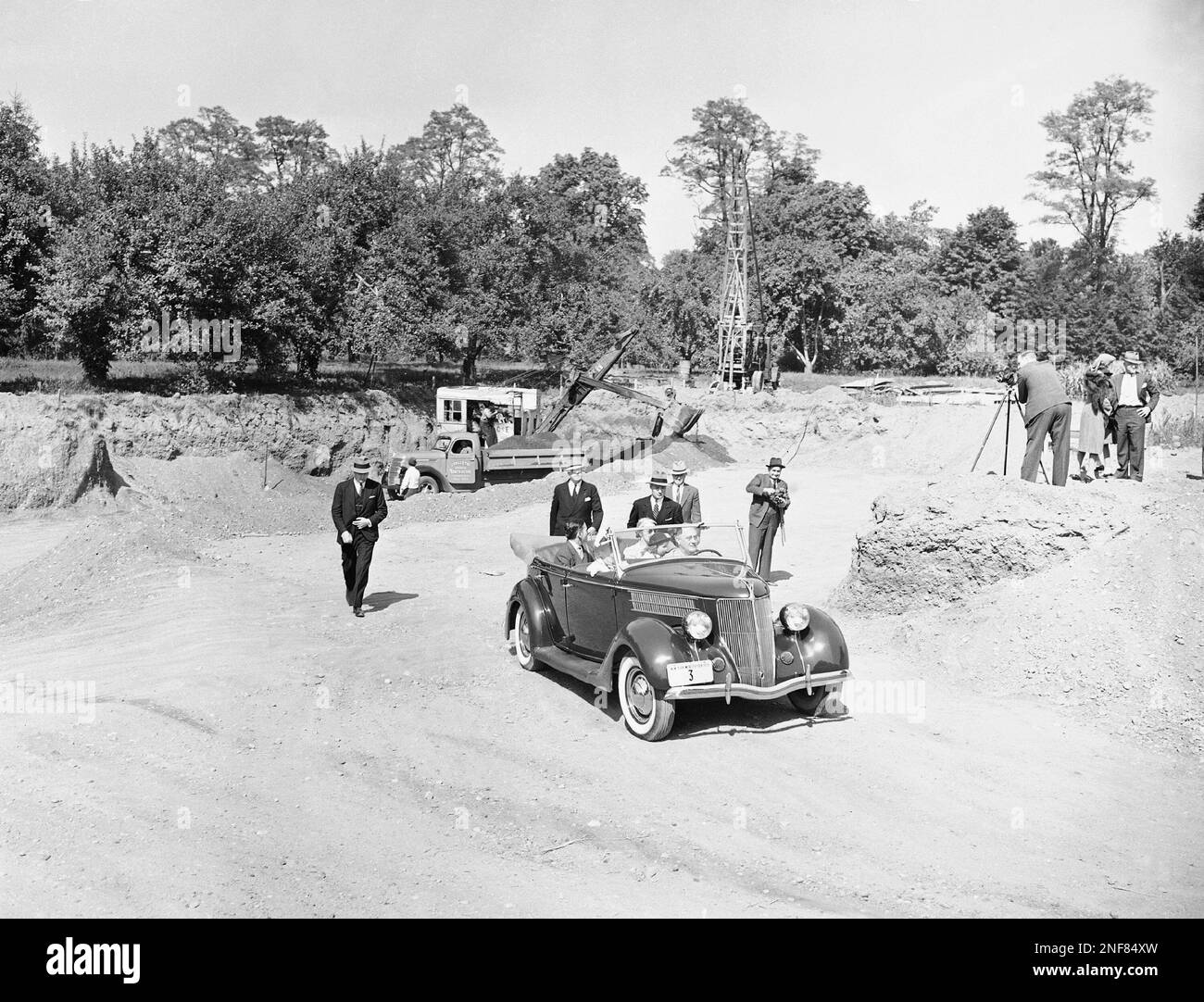 President Franklin Roosevelt (at wheel of automobile) inspects progress ...