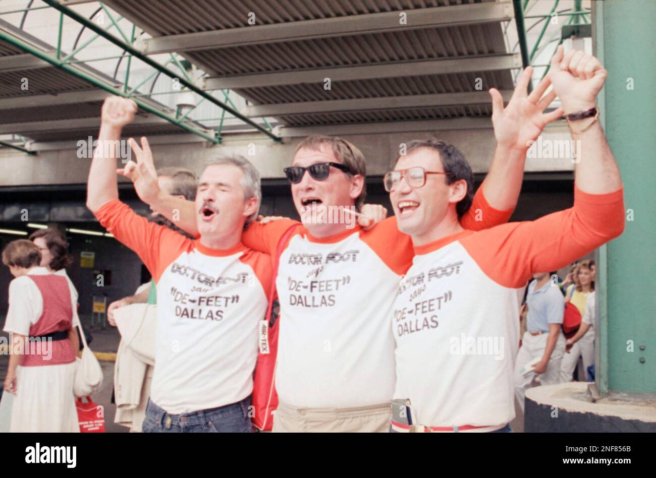 Three fans from Chicago celebrate their arrival at London’s Heathrow ...
