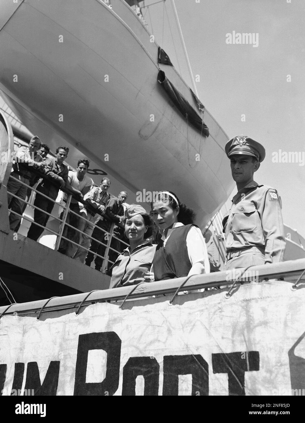 Iva Toguri D'Aquino, center, 32, takes a final look at Japan, as she ...