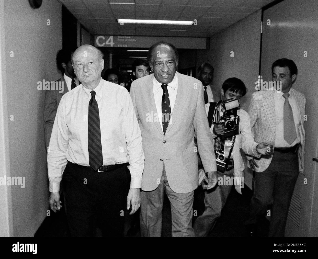 New York City Mayor Edward Koch, left, is accompanied by Police ...