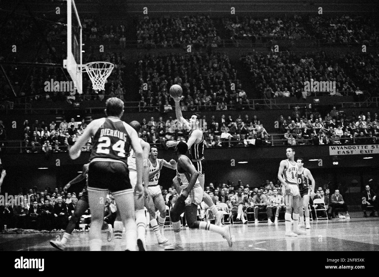 Jerry Lucas, right, gets up high to push one in to score for the ...
