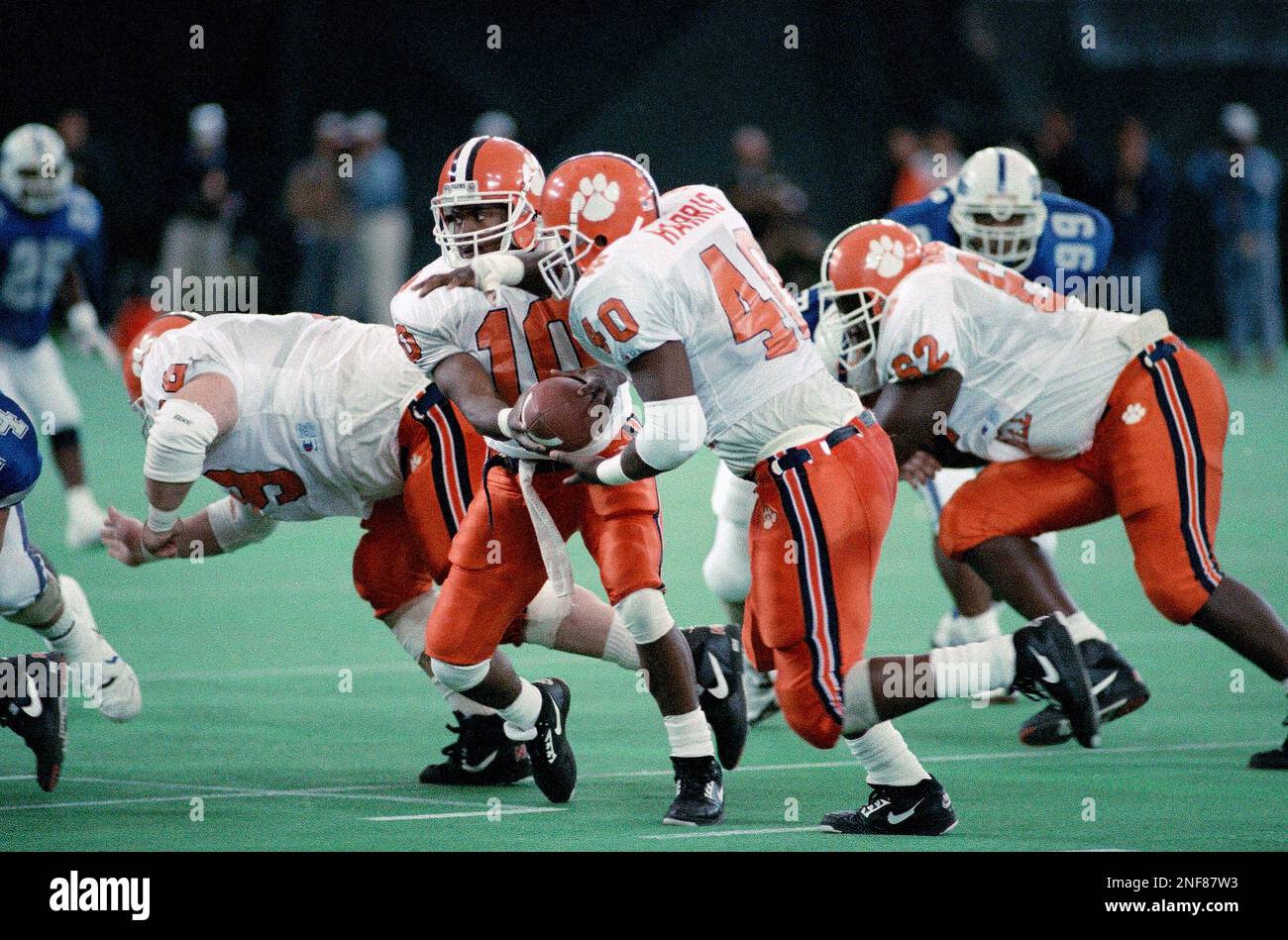 Clemson quarterback DeChane Cameron hands off the football to Rudy ...