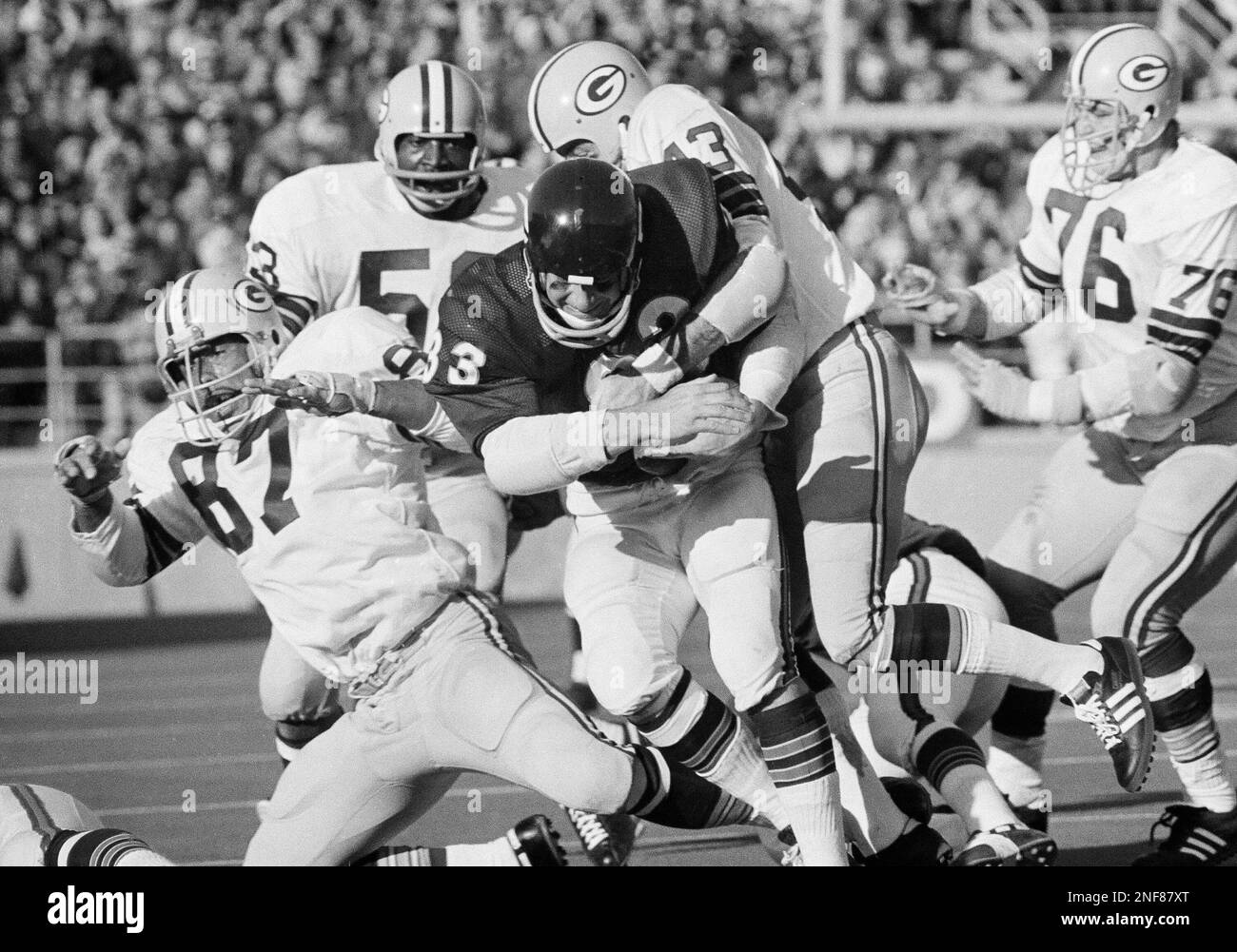 Chicago Bears running back Jim Grabowski (33) is swarmed by Green Bay ...