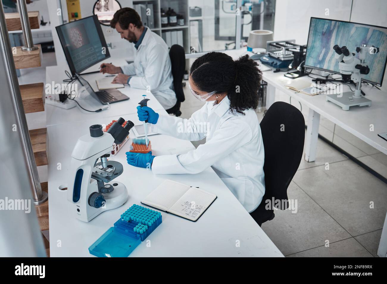 Technology, teamwork or collaboration in laboratory research, dropper ...