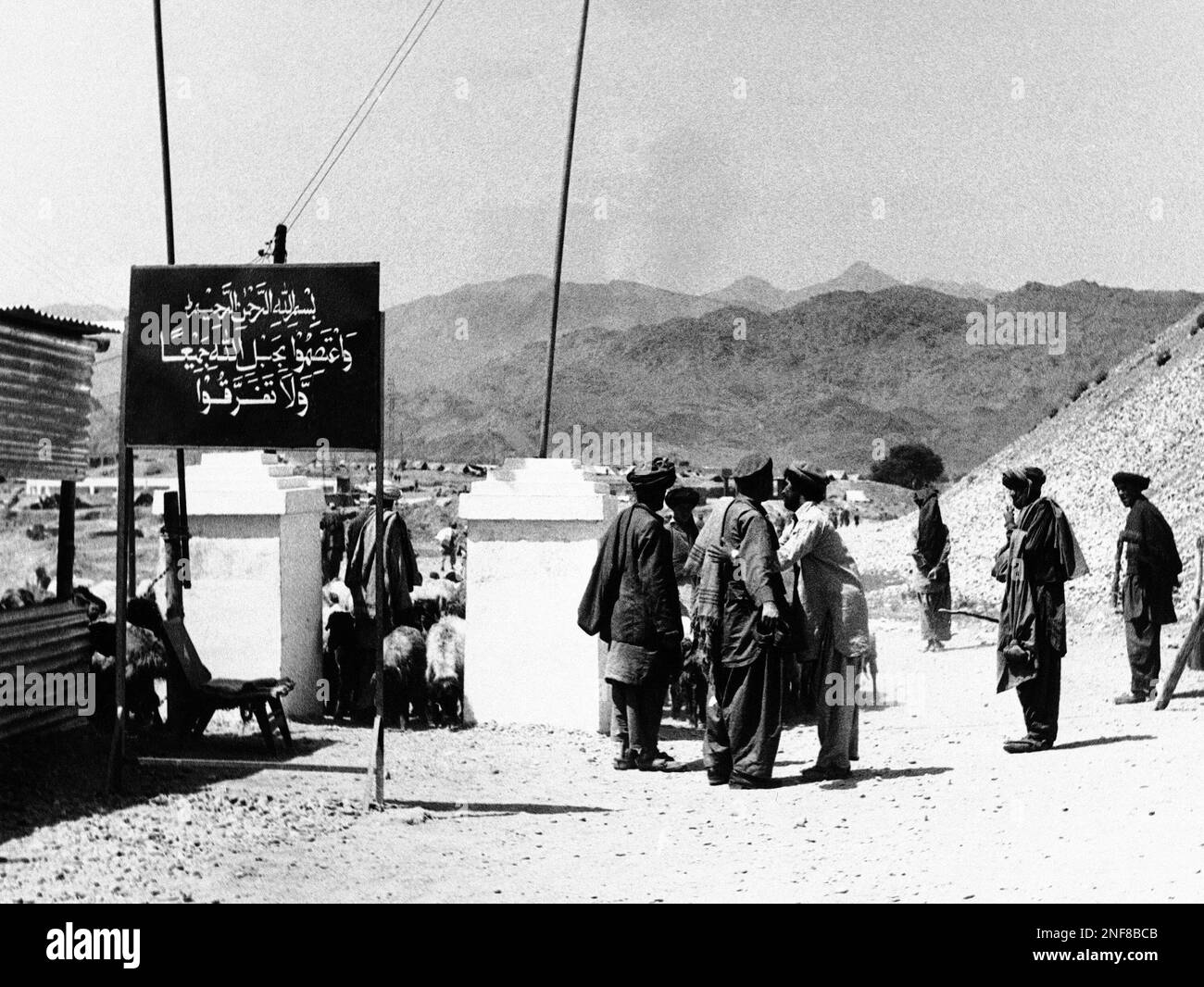 A visitor is frisked by guards before being allowed entry to an Afghan ...