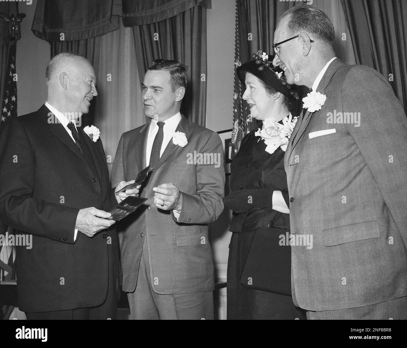 President Dwight Eisenhower receives a gold pass to the annual National ...