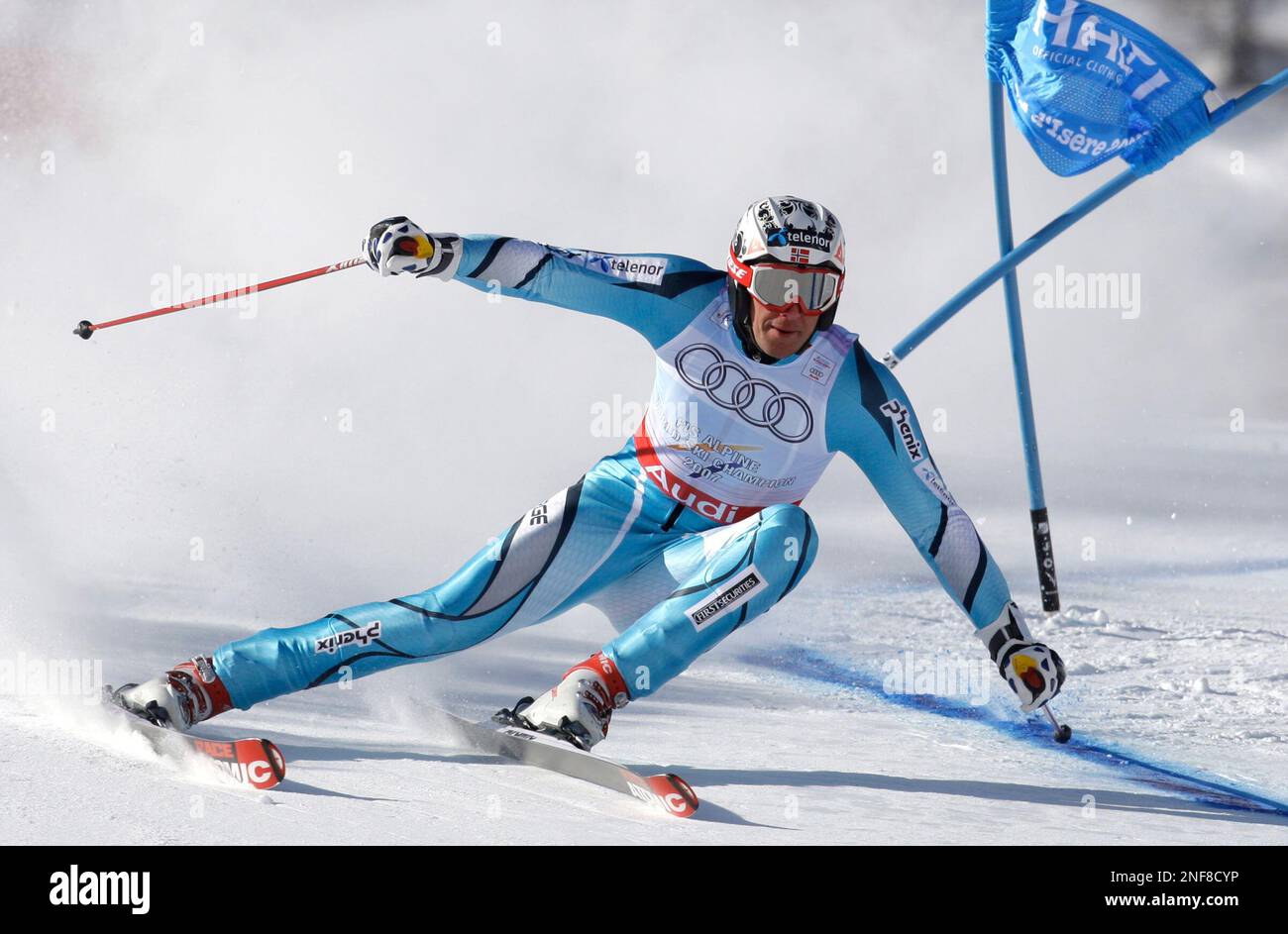 Norway's Aksel Lund Svindal powers past a gate during the first run of ...