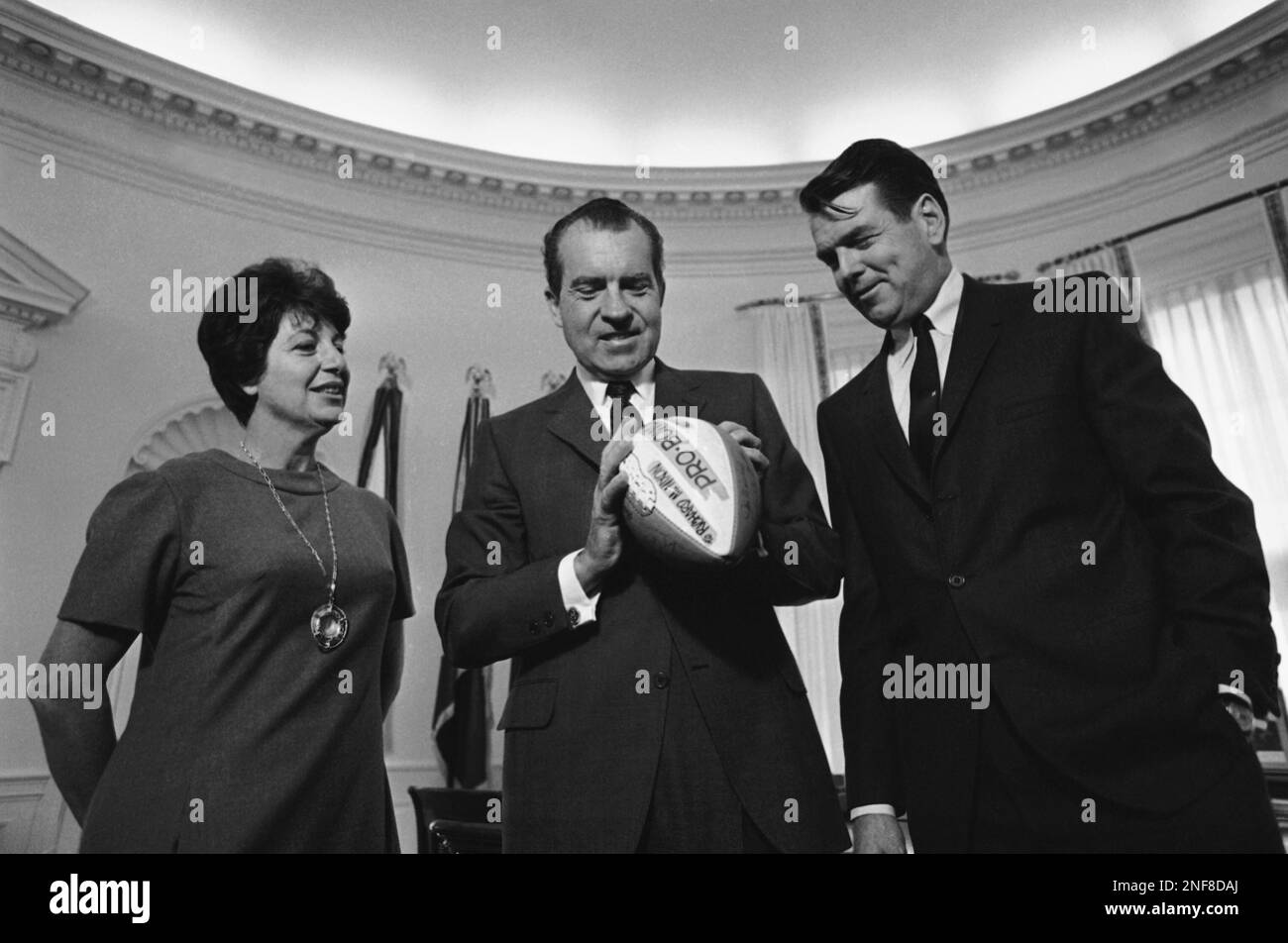 President Richard Nixon receives a trophy football from the NFL from ...