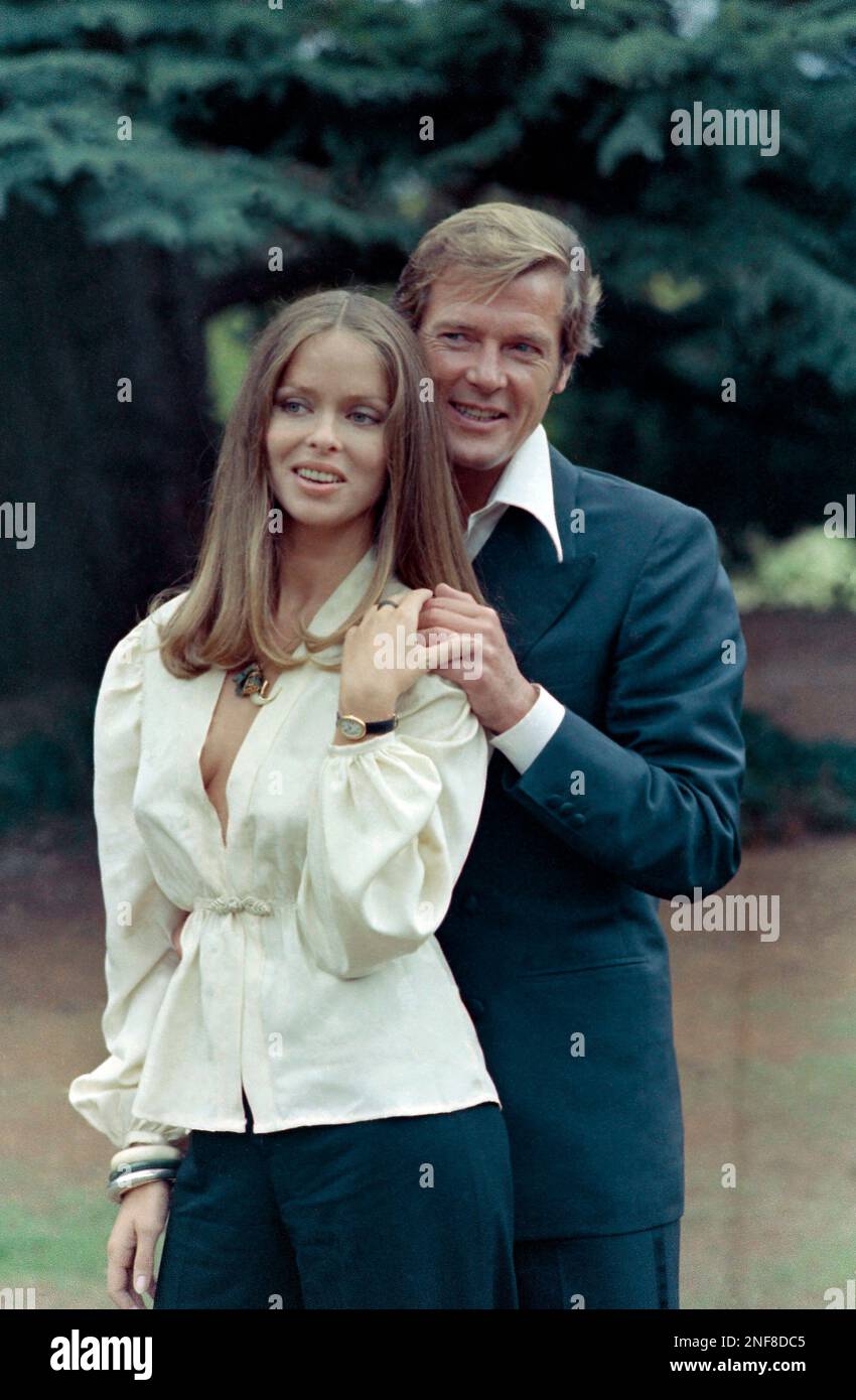 Actor Roger Moore, right, poses with American actress Barbara Bach, his ...