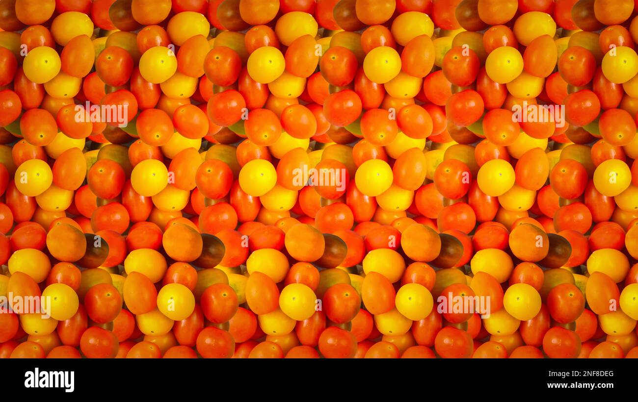 A heap of Small red cherry tomatoes background Stock Photo - Alamy