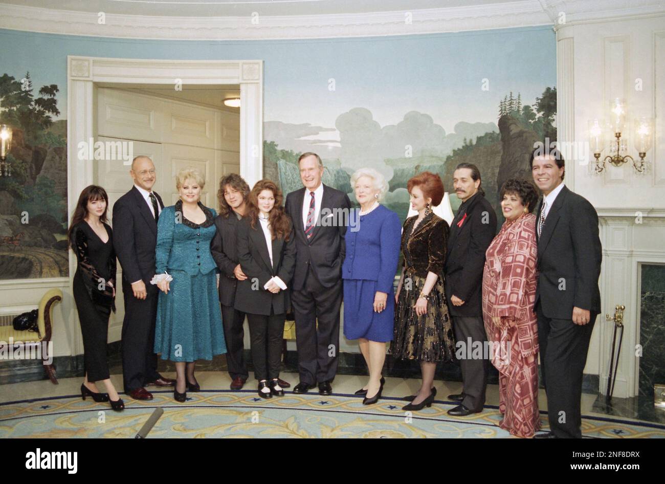 President George Bush and first lady Barbara Bush pose with ...