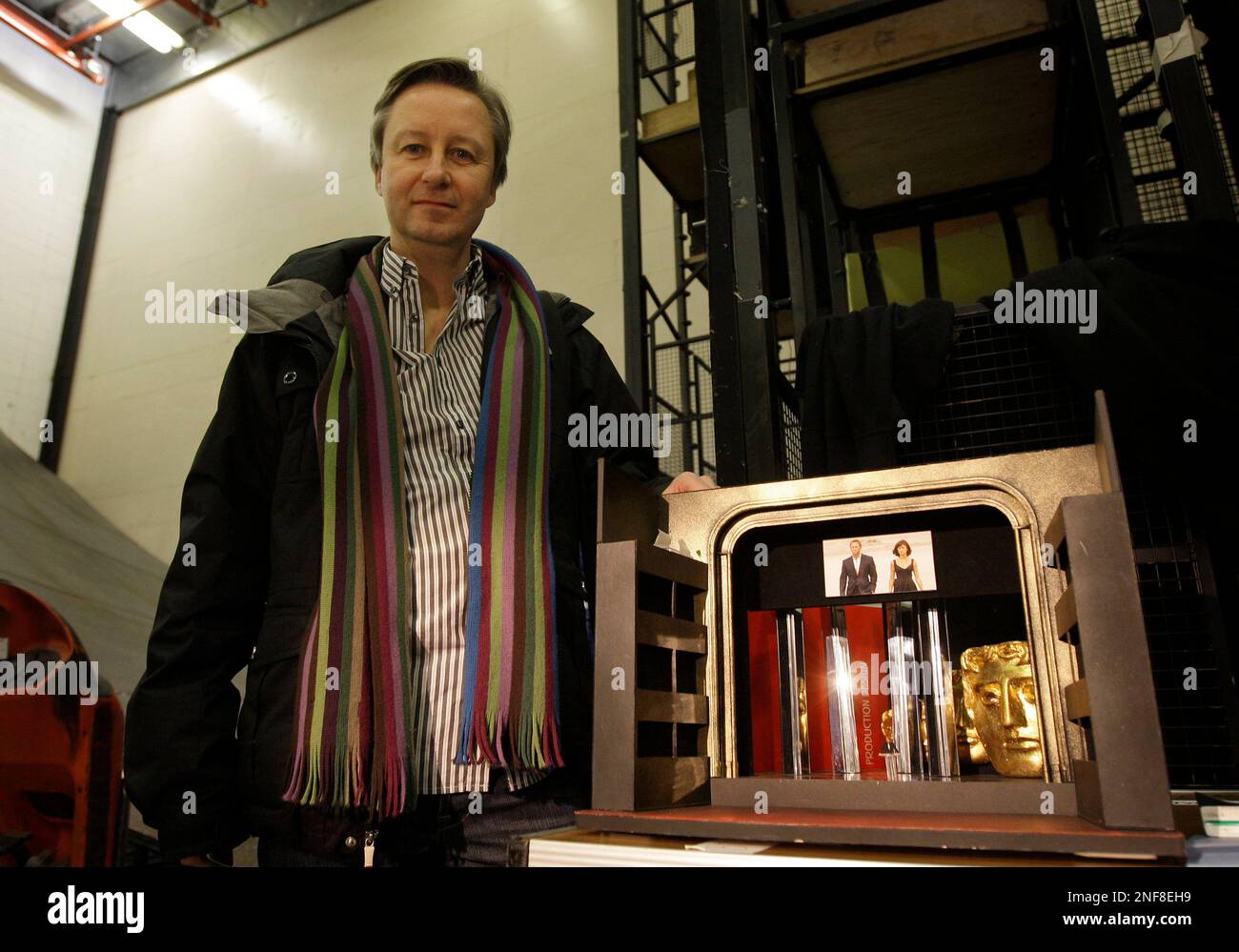 British Designer Peter Bingemann stands behind his miniature set design ...