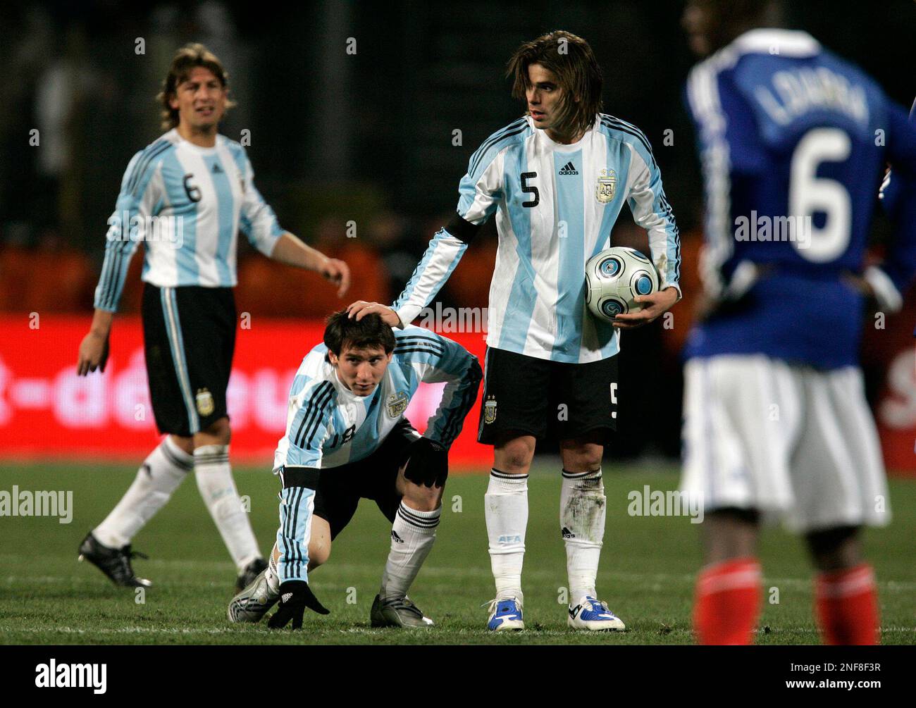 Argentina's Gabriel Heinze, left, Lionel Messi, center, and Fernando ...