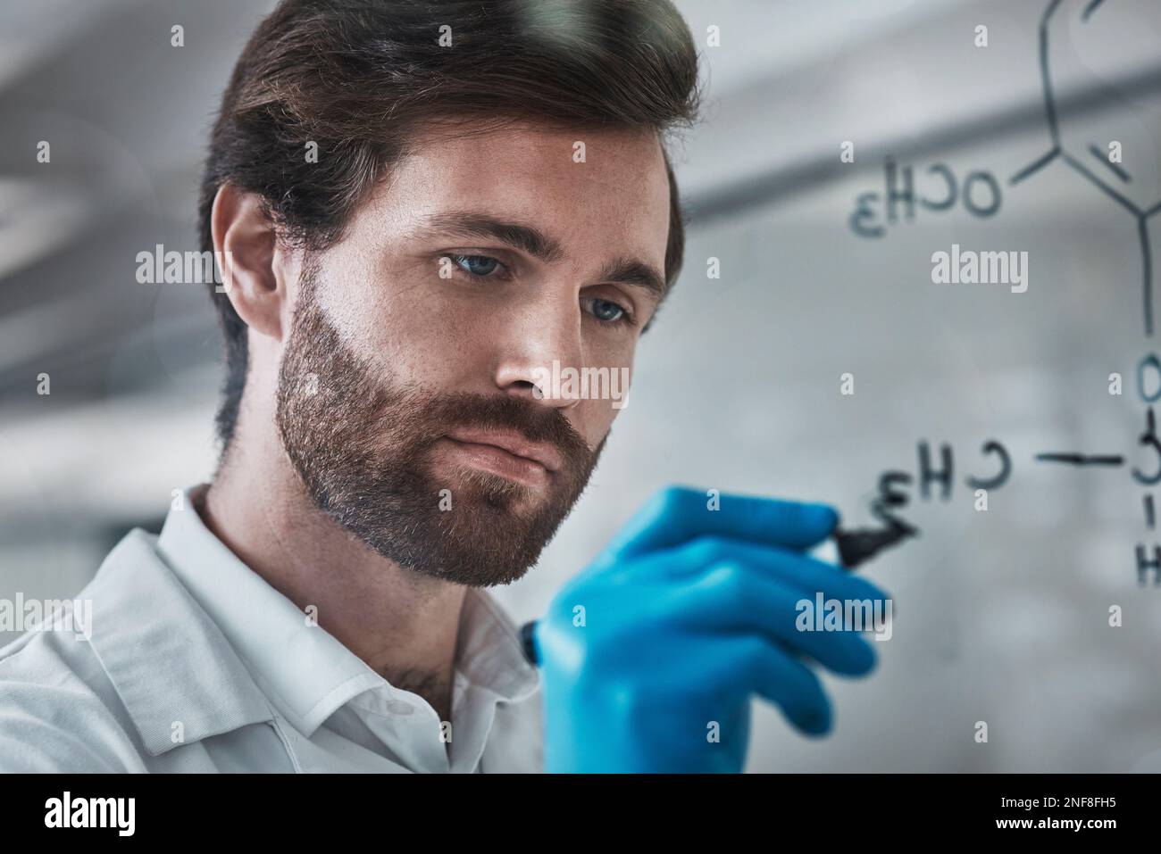 Serious, science and chemistry with man writing in laboratory for ...