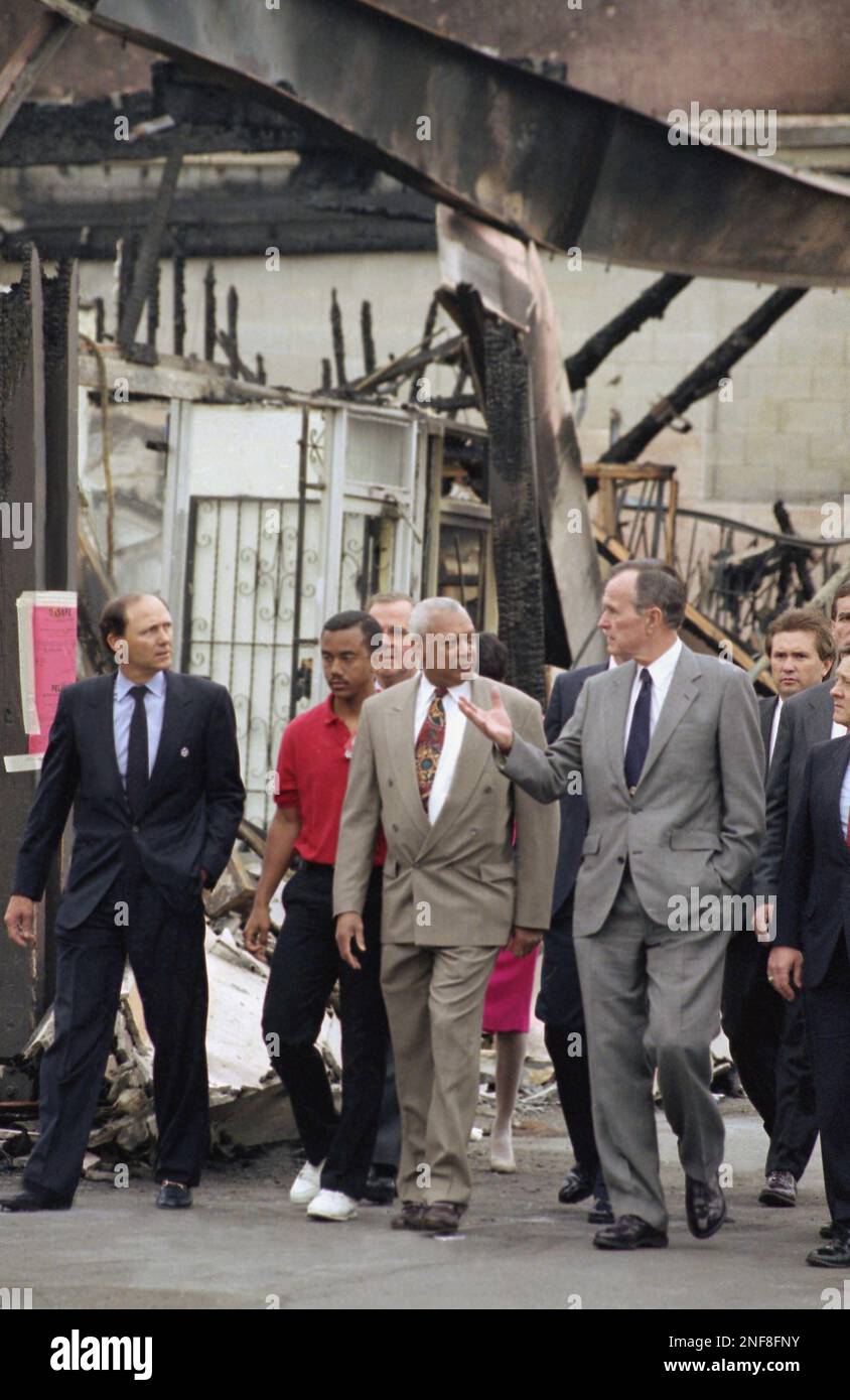 President George Bush, right, walks through the Crenshaw Town Center in ...